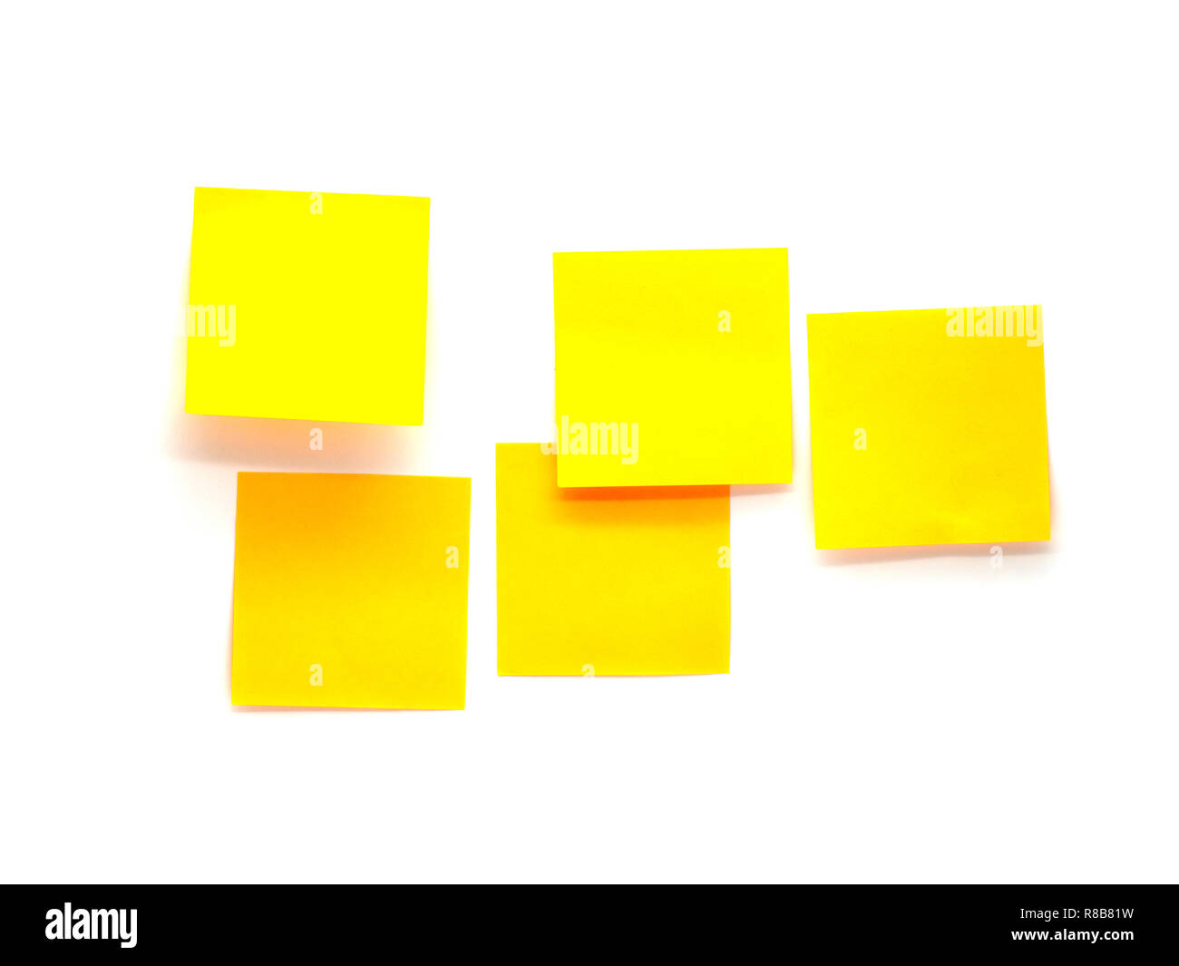 Orange paper stick note on a white background Stock Photo - Alamy