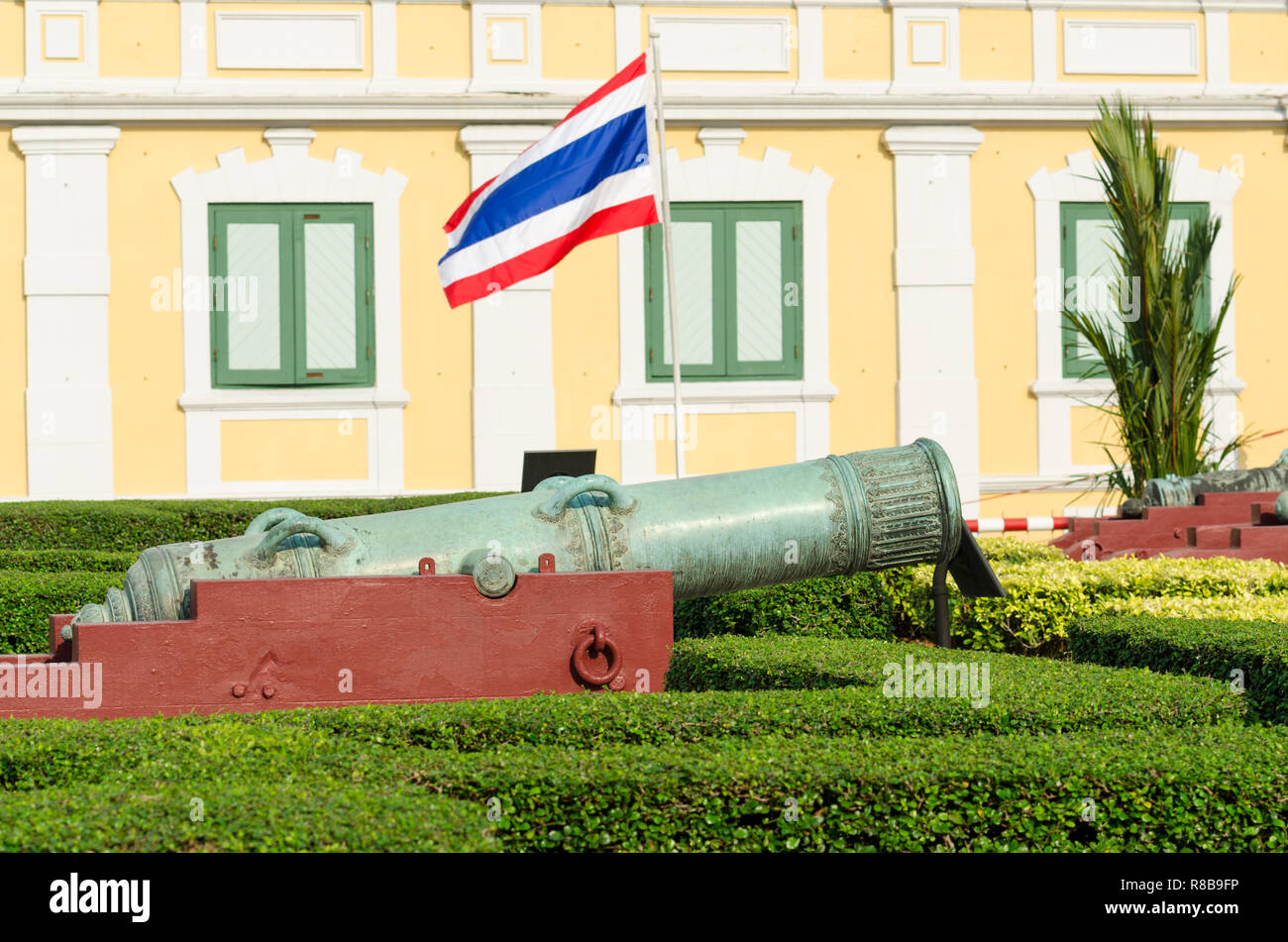 Old cannon and Thai flag in front of Ministry of Defence, Ancient ...