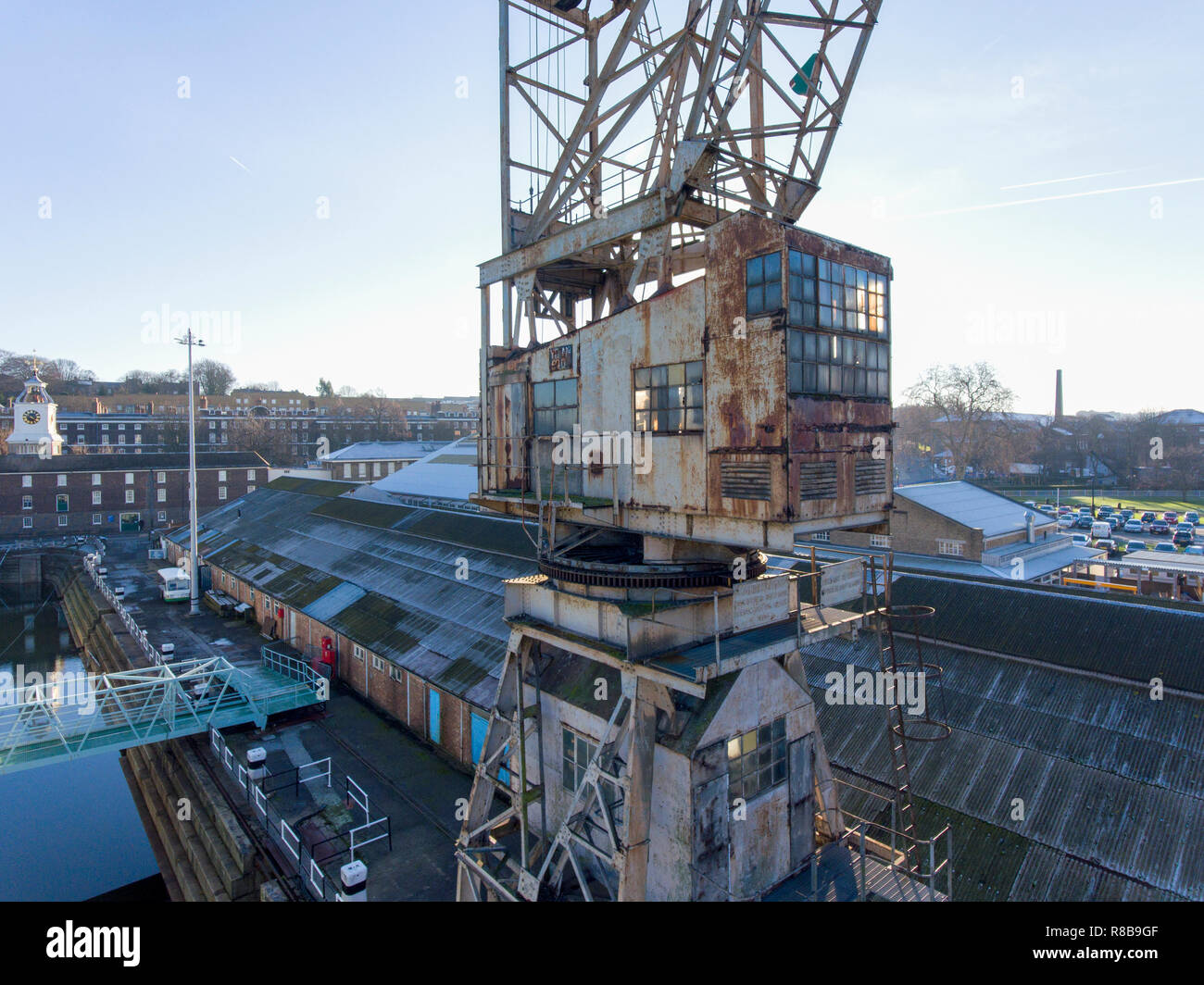 Dockside crane lit by early morning sun at Chatham Historic Dockyard ...