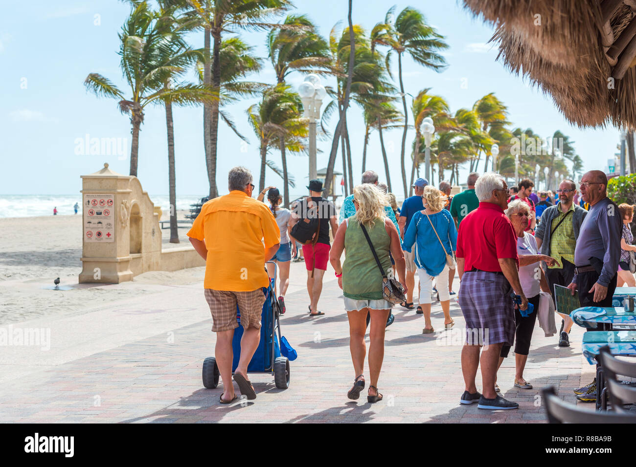 MIAMI, FLORIDA - JANUARY 21, 2018: A crowd of people on the waterfront ...