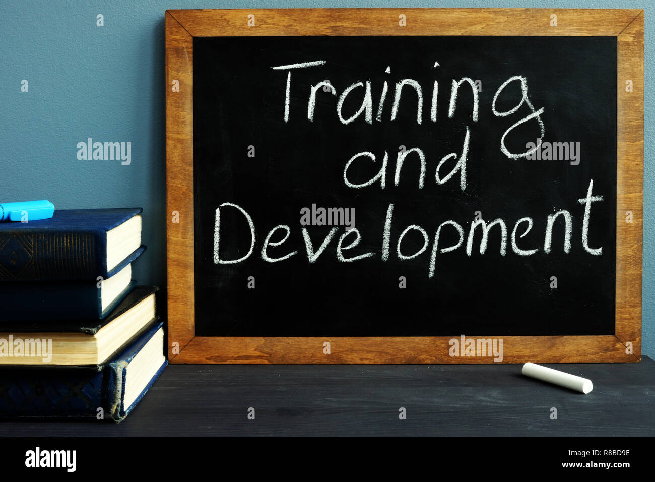 Training and development handwritten on a blackboard Stock Photo - Alamy