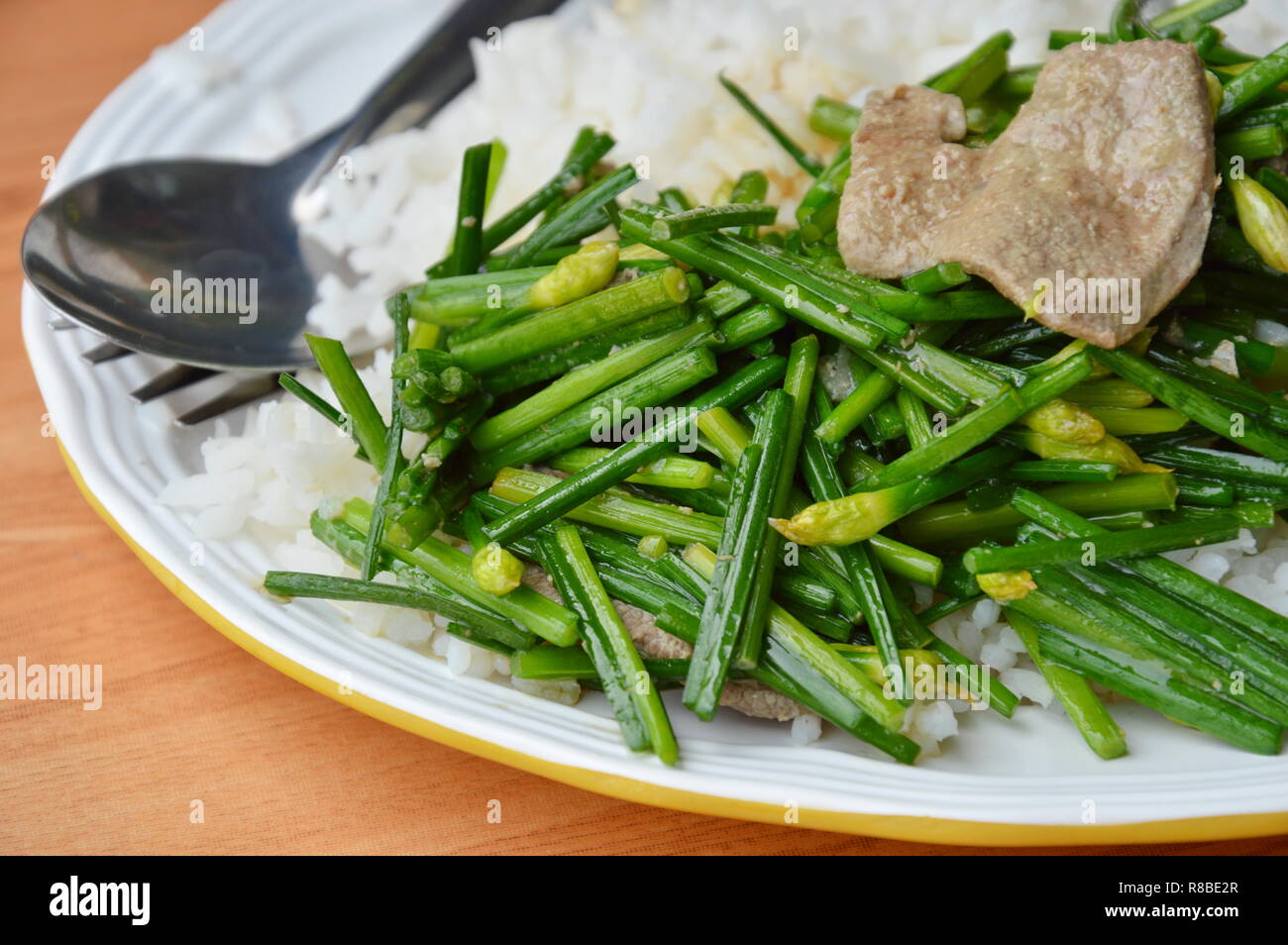 stir fried garlic chives with pork liver on rice Stock Photo - Alamy