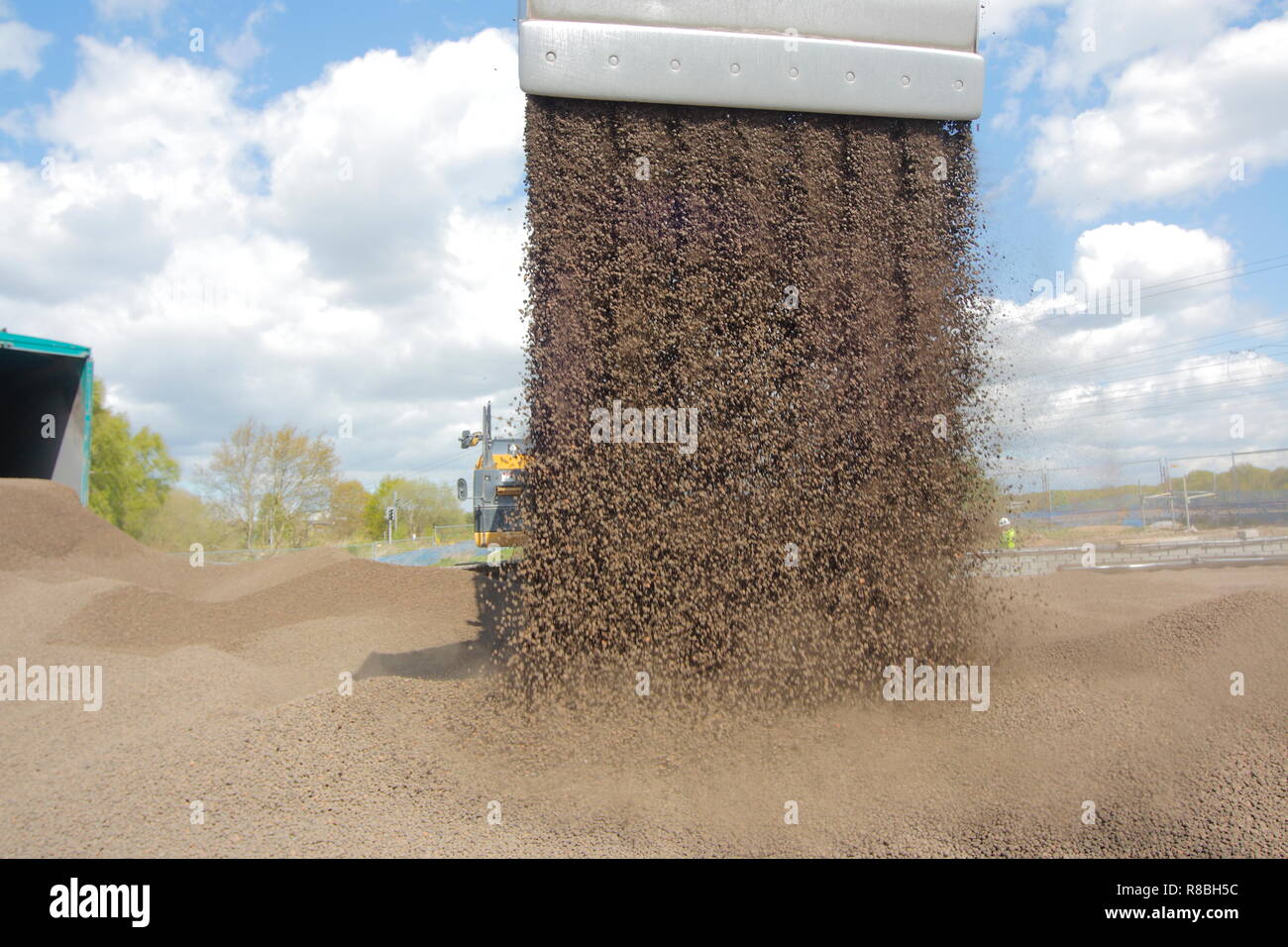 A Caterpillar 320E levelling out lightweight expanded clay aggregate ...