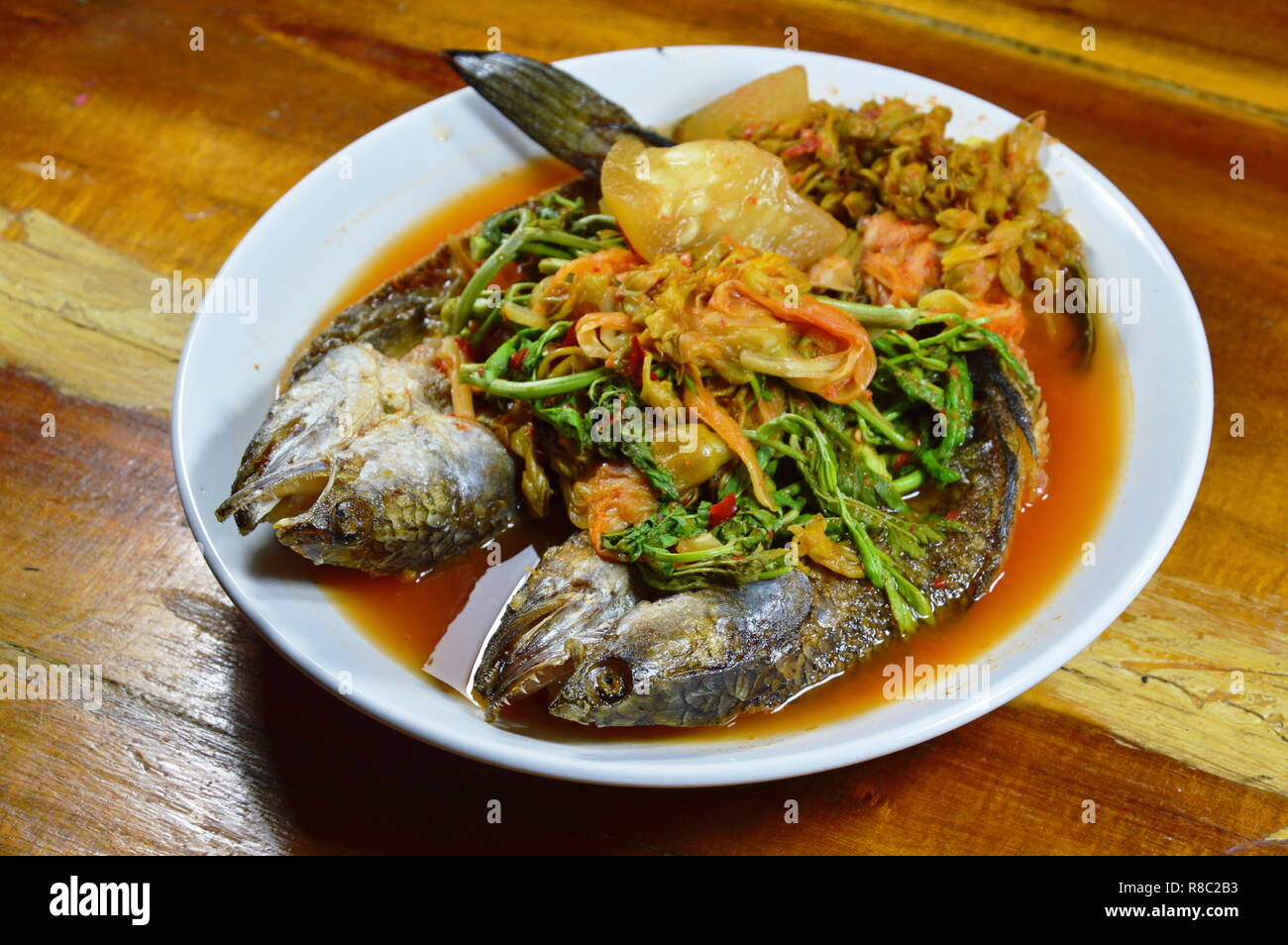 deep fried snake head fish eat couple with mixed vegetable Thai spicy ...