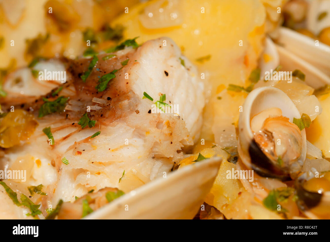 Dish fish sauce yellow spain hi-res stock photography and images - Alamy