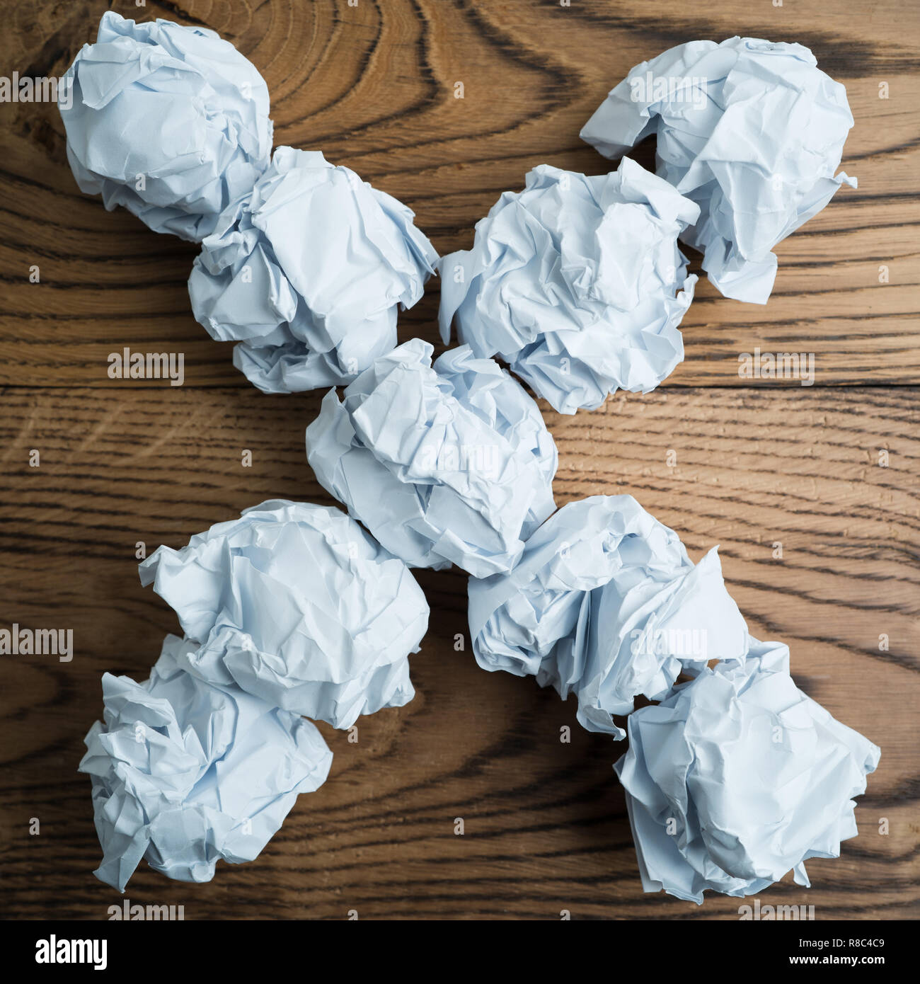 crumpled paper symbolizing different solutions forming a cross Stock ...