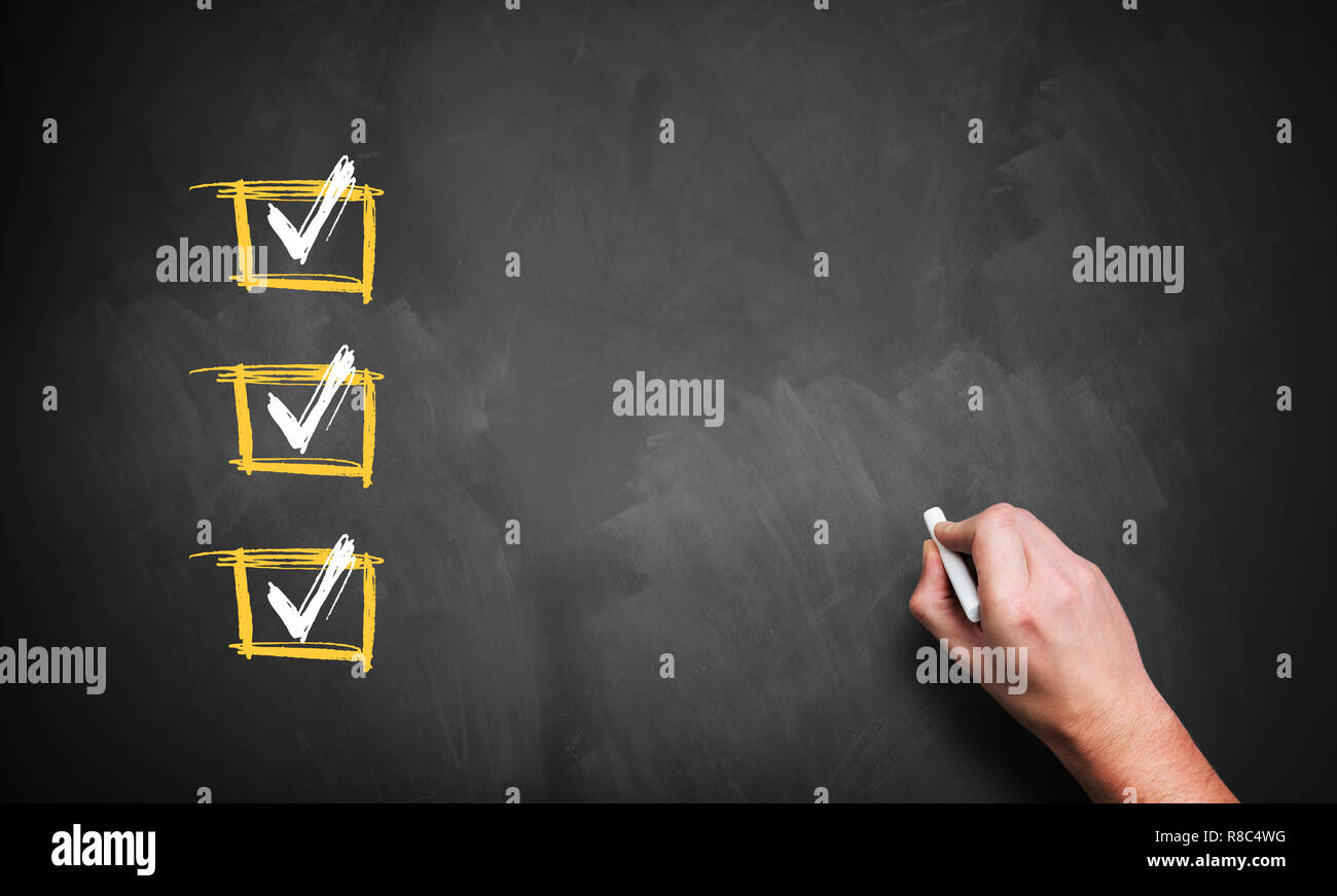 hand writing on a blackboard with checked boxes Stock Photo - Alamy