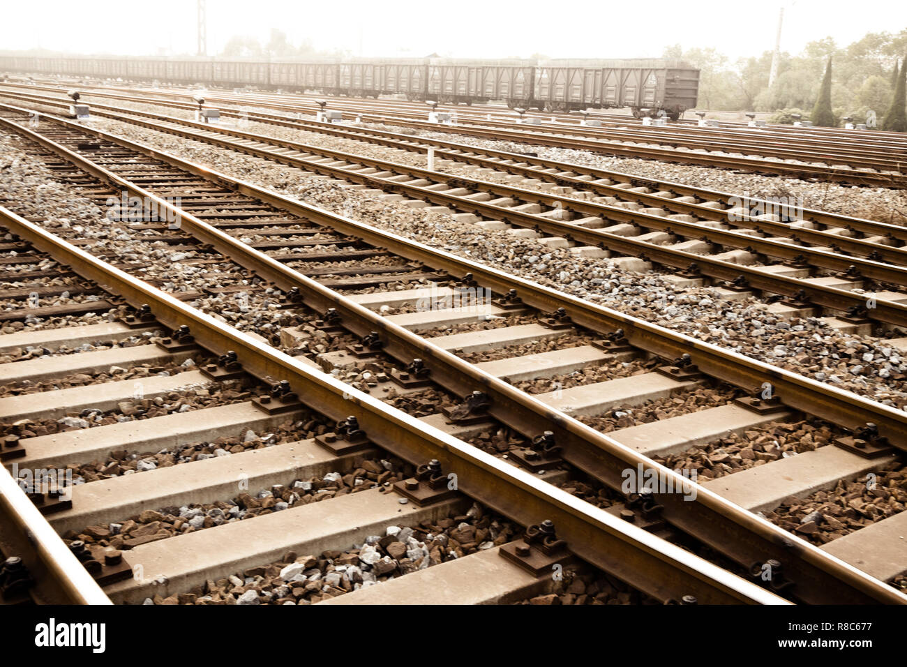 Railway in fog on station, outdoor landscape Stock Photo - Alamy