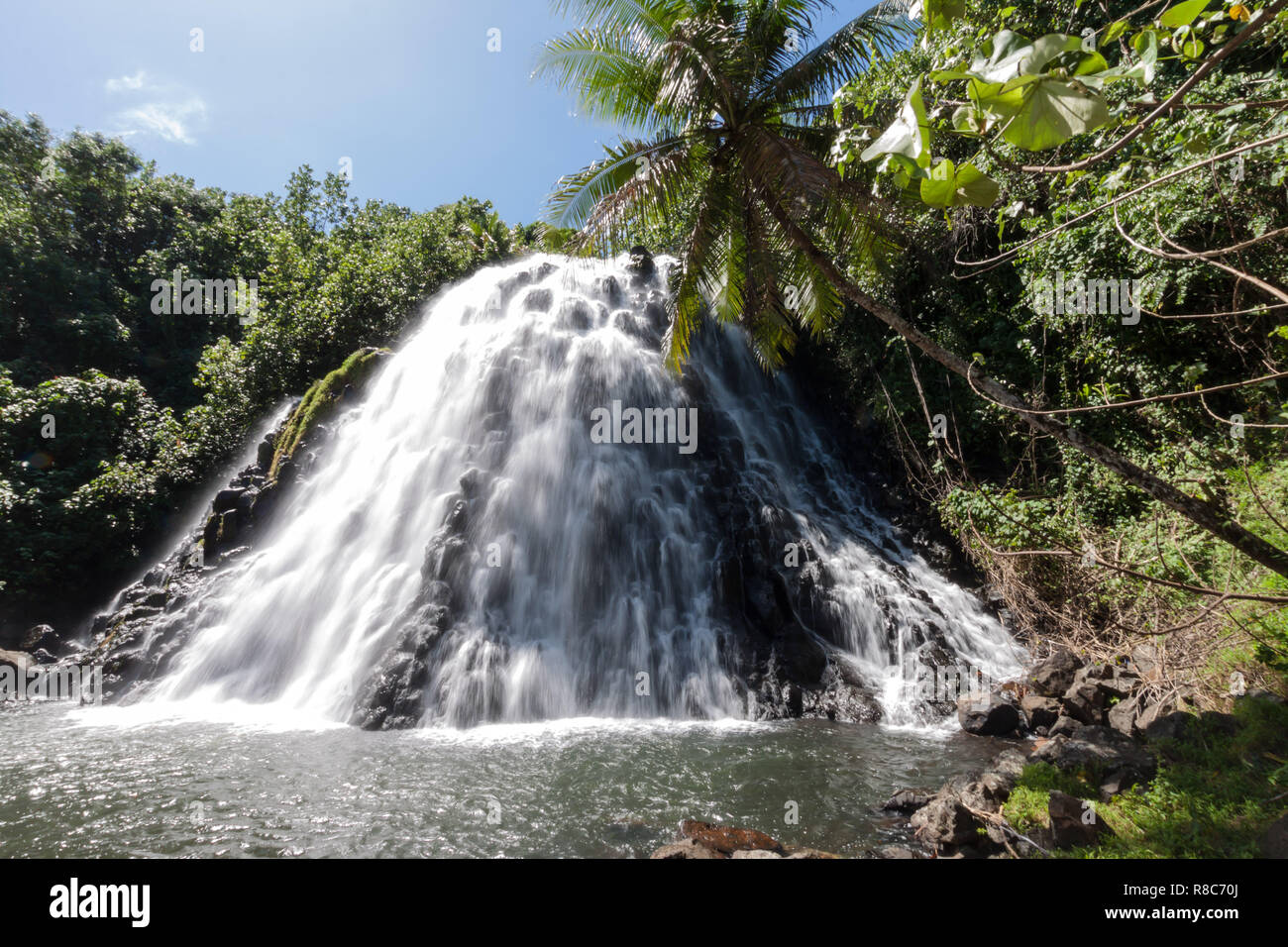 Kepirohi waterfall in the jungle with palm trees around, near Nan Madol ...