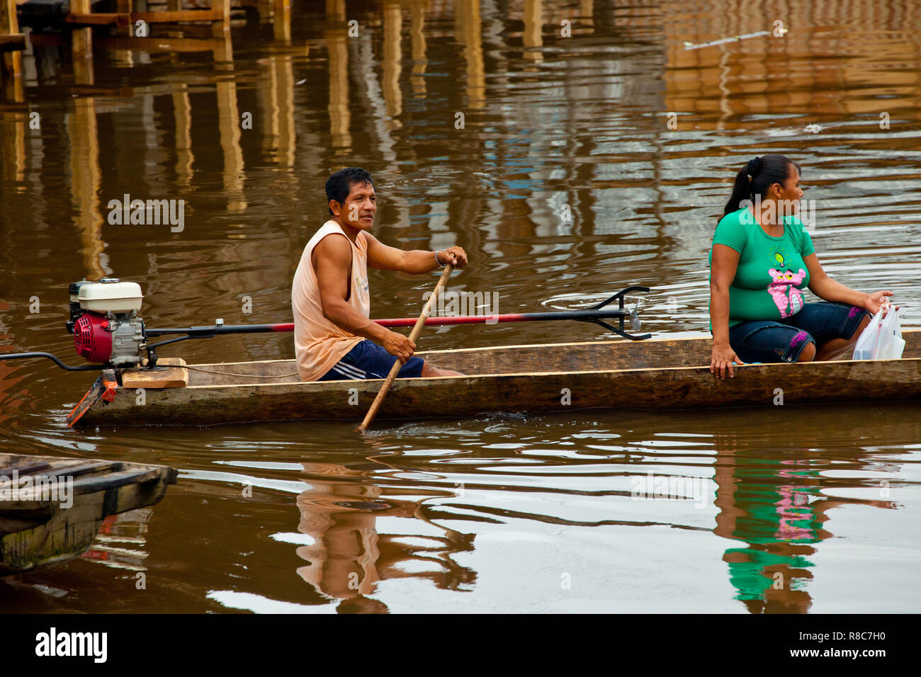 A man rowing at Belen flooded roads in Iquitos,Peru Stock Photo - Alamy