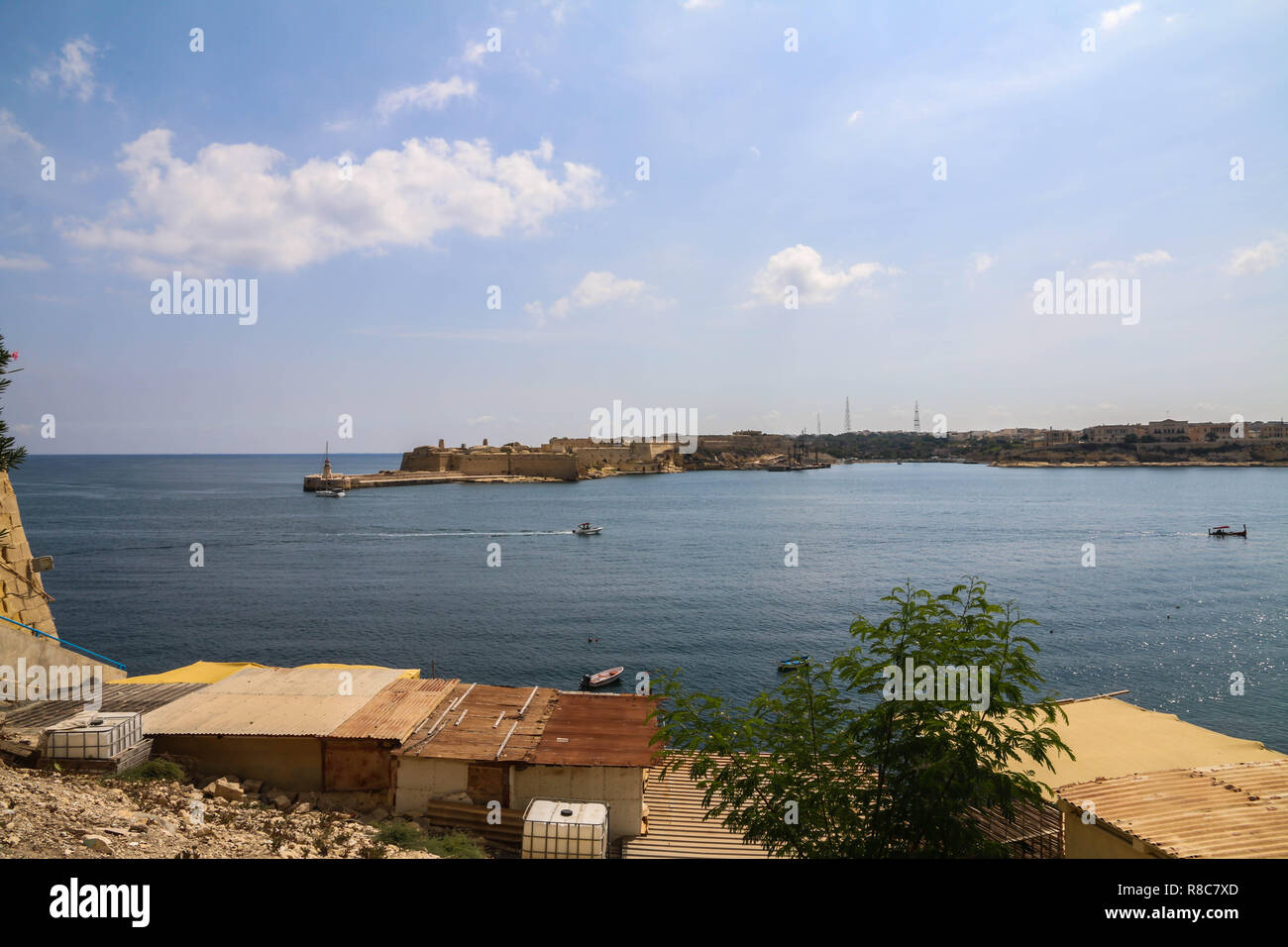 War museum and lighthouse at the harbour of Valletta, Malta Stock Photo ...