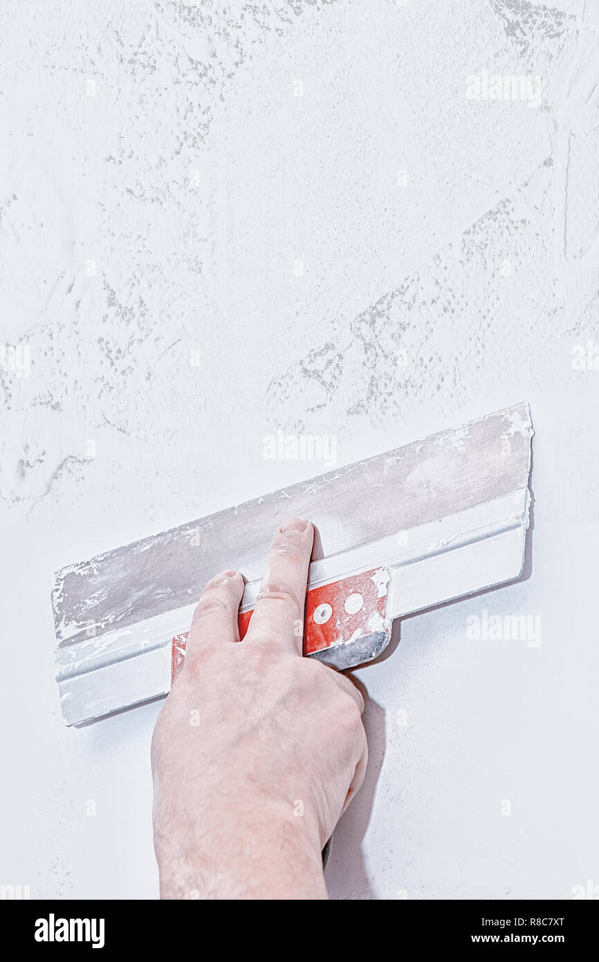 Applying putty plaster hi-res stock photography and images - Alamy