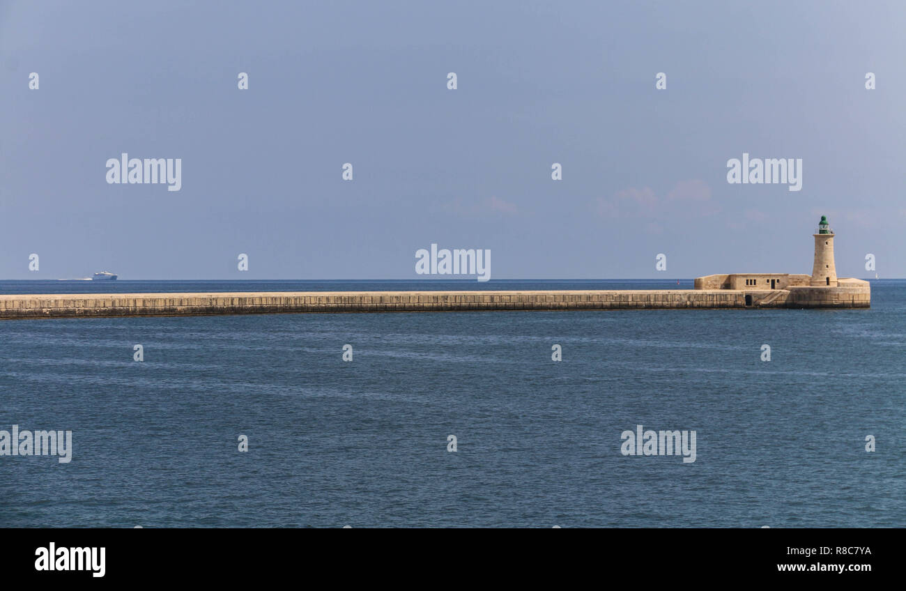 War museum and lighthouse at the harbour of Valletta, Malta Stock Photo ...