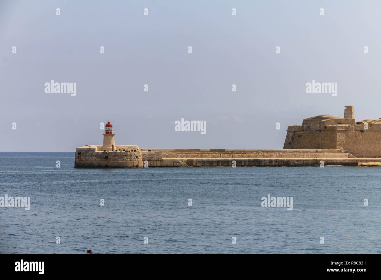 War museum and lighthouse at the harbour of Valletta, Malta Stock Photo ...