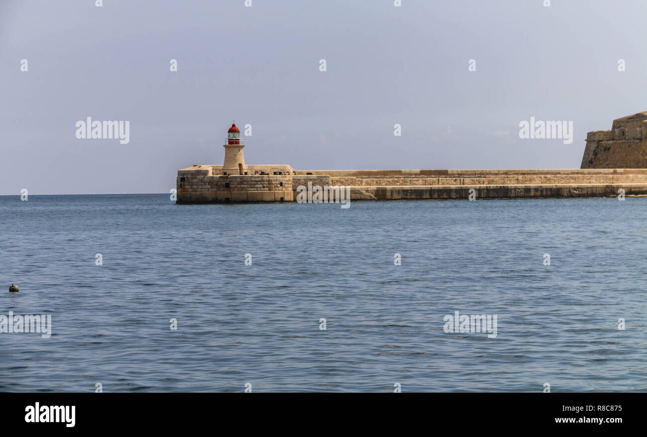 War museum and lighthouse at the harbour of Valletta, Malta Stock Photo ...