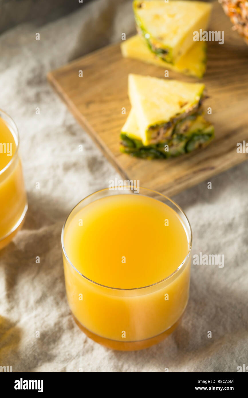 Raw Orange Pineapple Juice in a Glass Stock Photo - Alamy