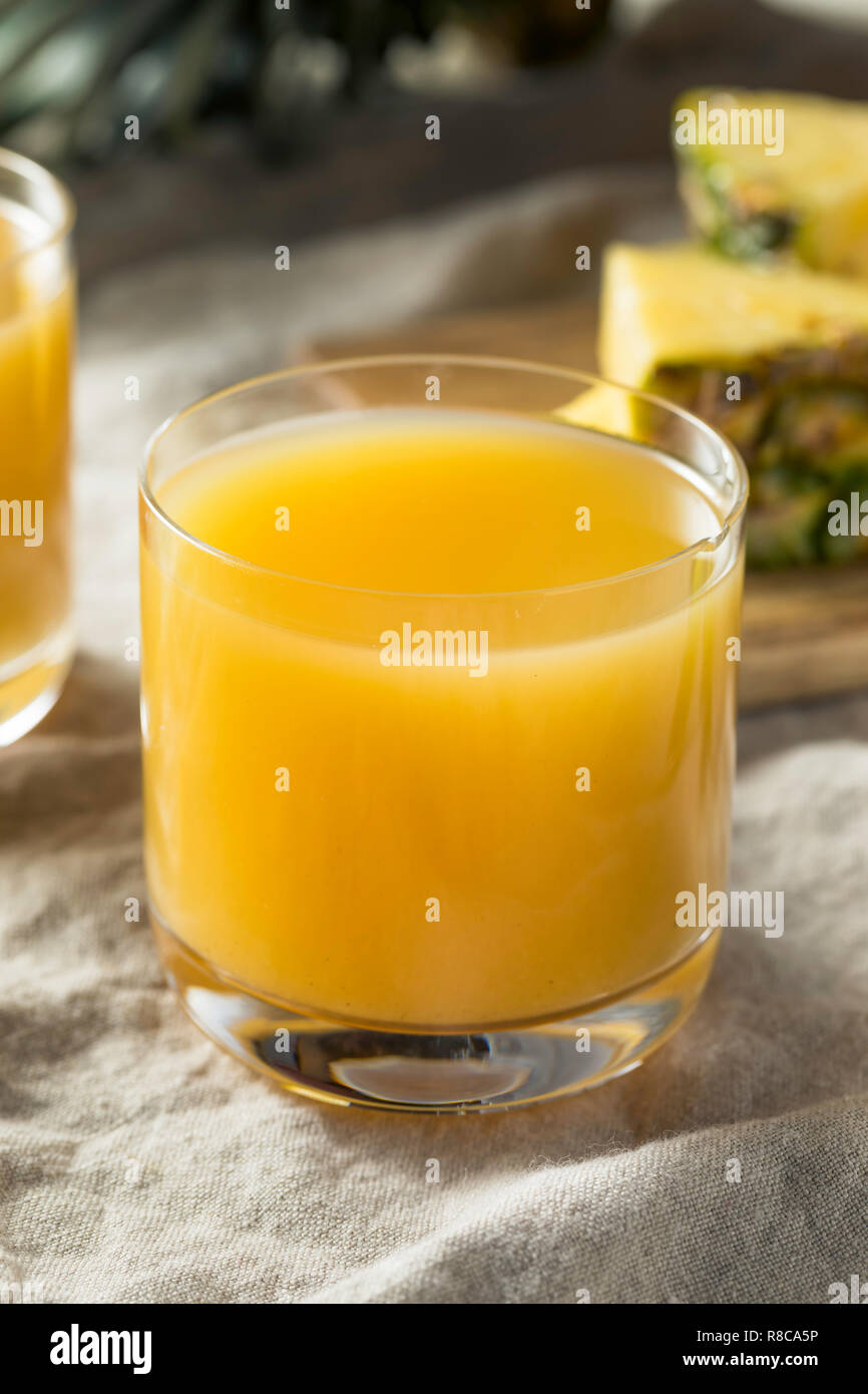 Raw Orange Pineapple Juice in a Glass Stock Photo - Alamy