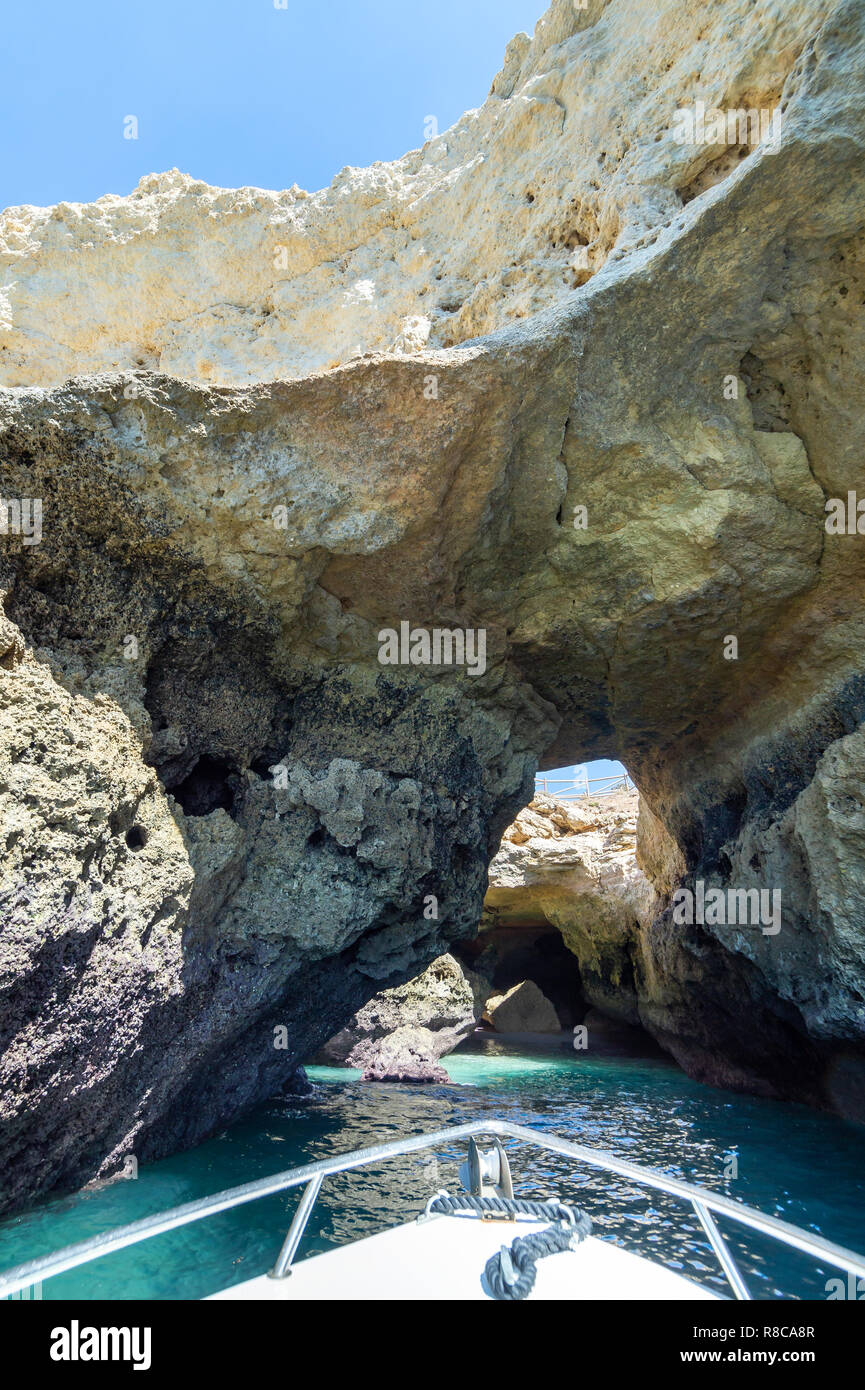 View of grotto cave, turquoise lagoon, limestone cliffs can be visited ...