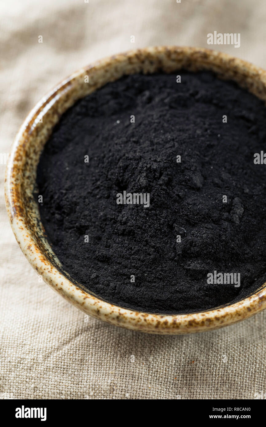 Raw Organic Black Activated Charcoal in a Bowl Stock Photo - Alamy