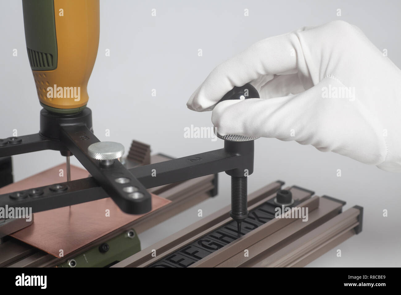Worker hands on Engraving device pantograph with CNC engraver with ...