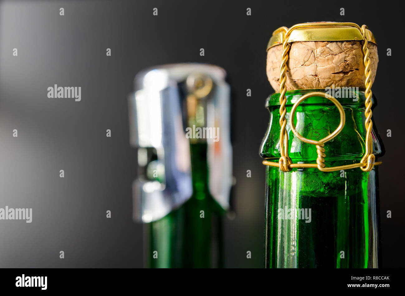 green champagne bottle with cork closeup Stock Photo - Alamy