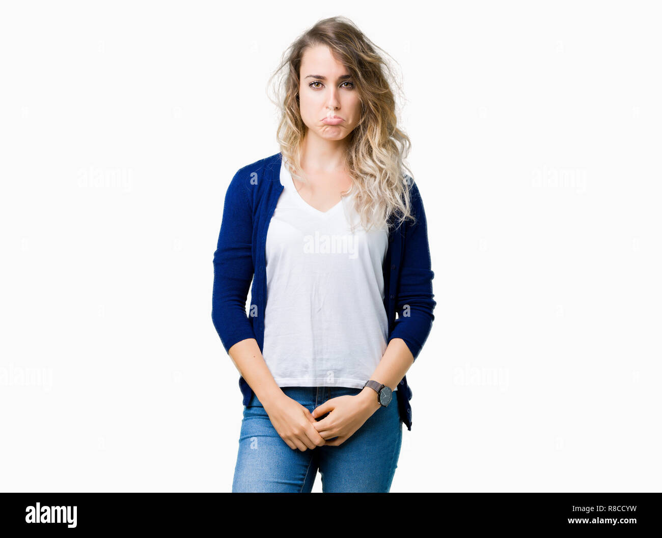 Beautiful young blonde woman over isolated background depressed and ...