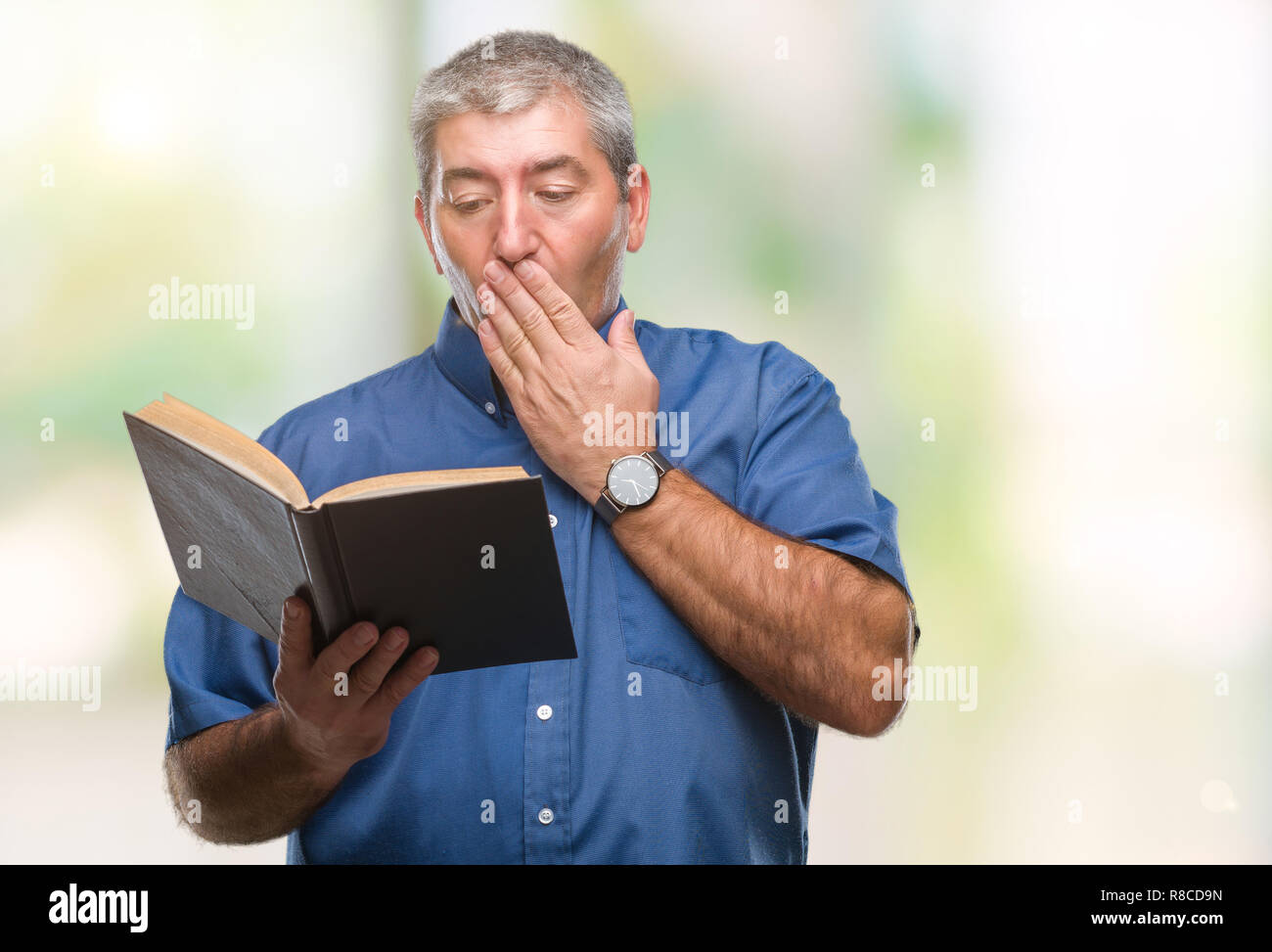 Man reading book shocked expression hi-res stock photography and images ...