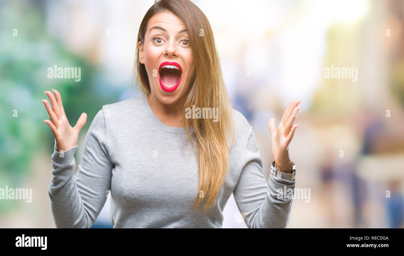 Young beautiful worker business woman over isolated background ...