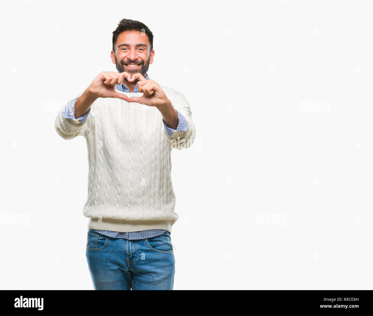 Adult hispanic man wearing winter sweater over isolated background ...