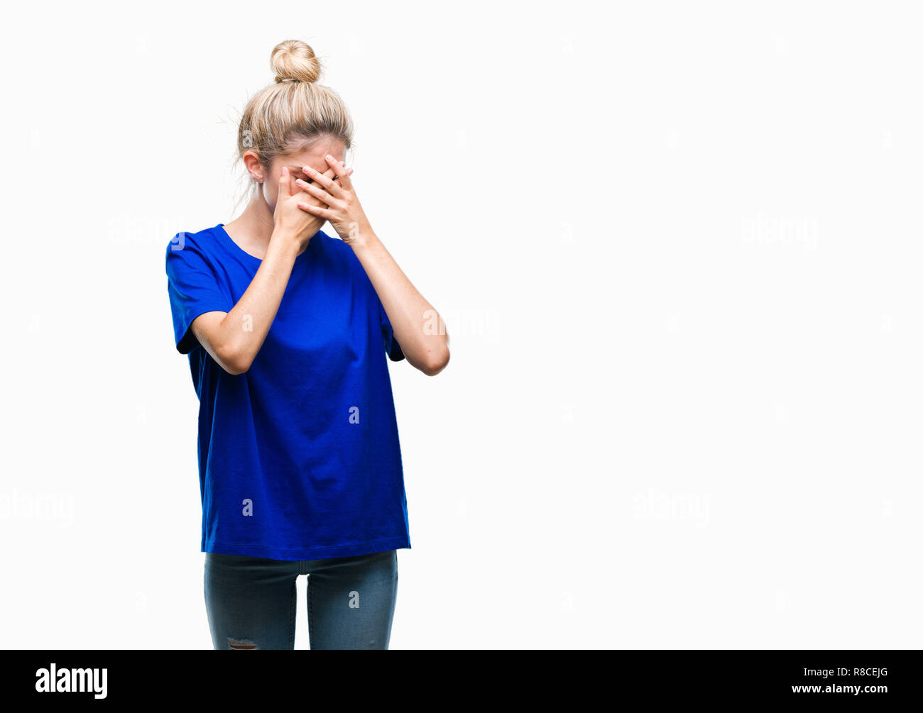 Young beautiful blonde and blue eyes woman wearing blue t-shirt over ...