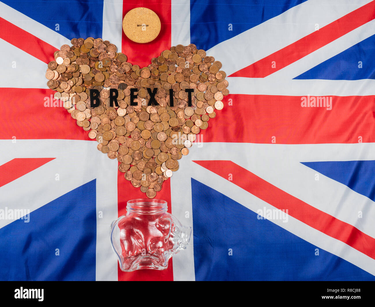 Brexit concept Union Jack and EU flag separated.Piggy coin bank on side ...