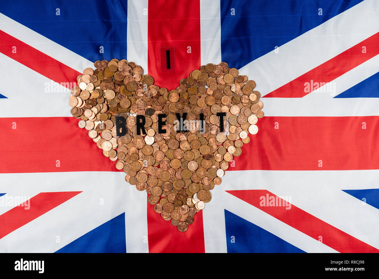 Brexit concept Union Jack and EU flag separated.Piggy coin bank on side ...