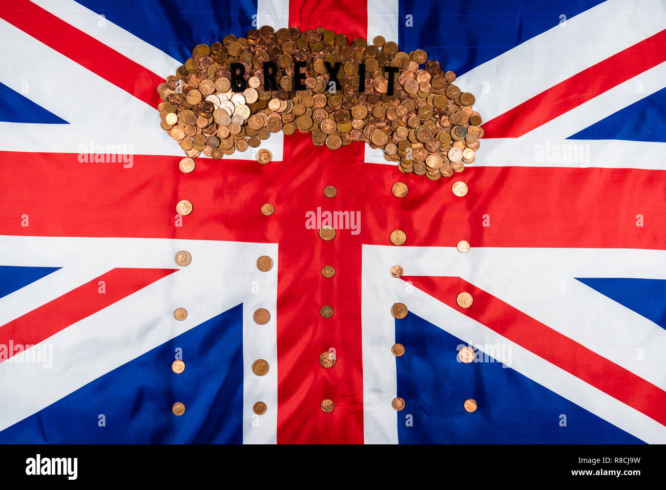 Brexit concept Union Jack and EU flag separated.Piggy coin bank on side ...