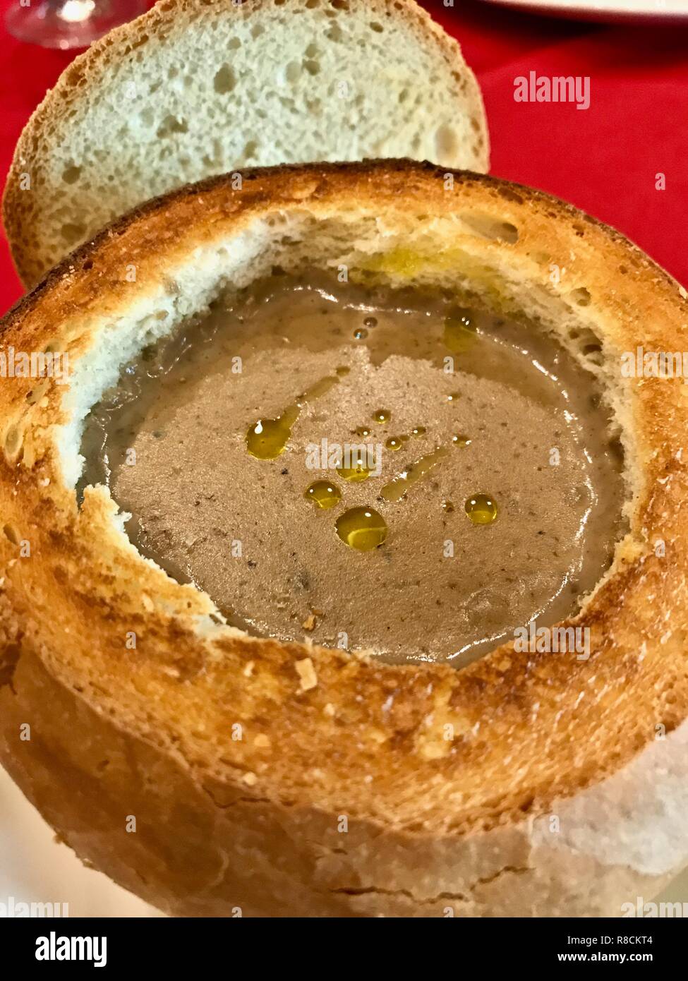 Cream of truffle and porcini mushroom served in a fresh wood fire baked ...