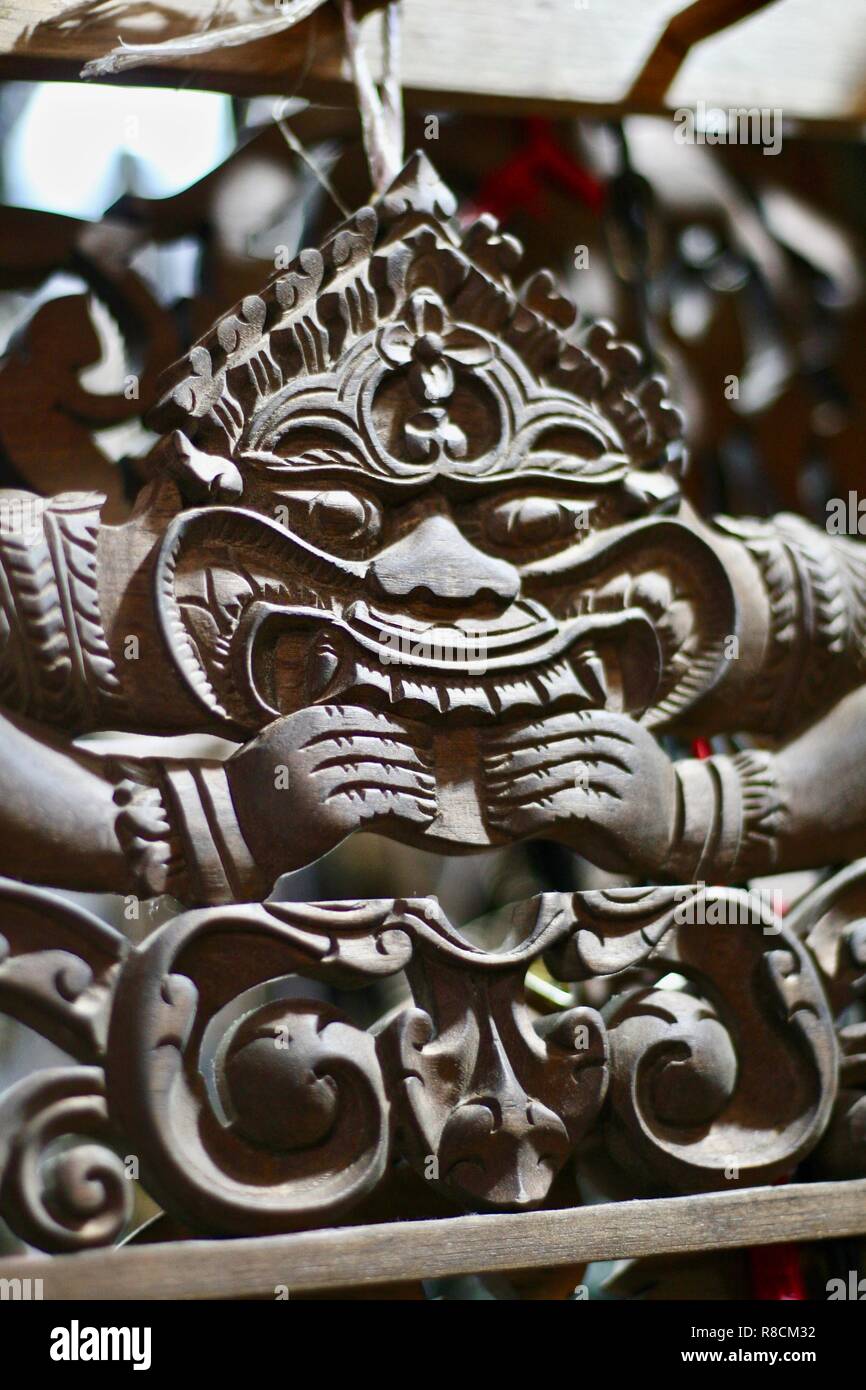 A carved wooden demon face eating bad spirits in Cambodia, sold as good ...
