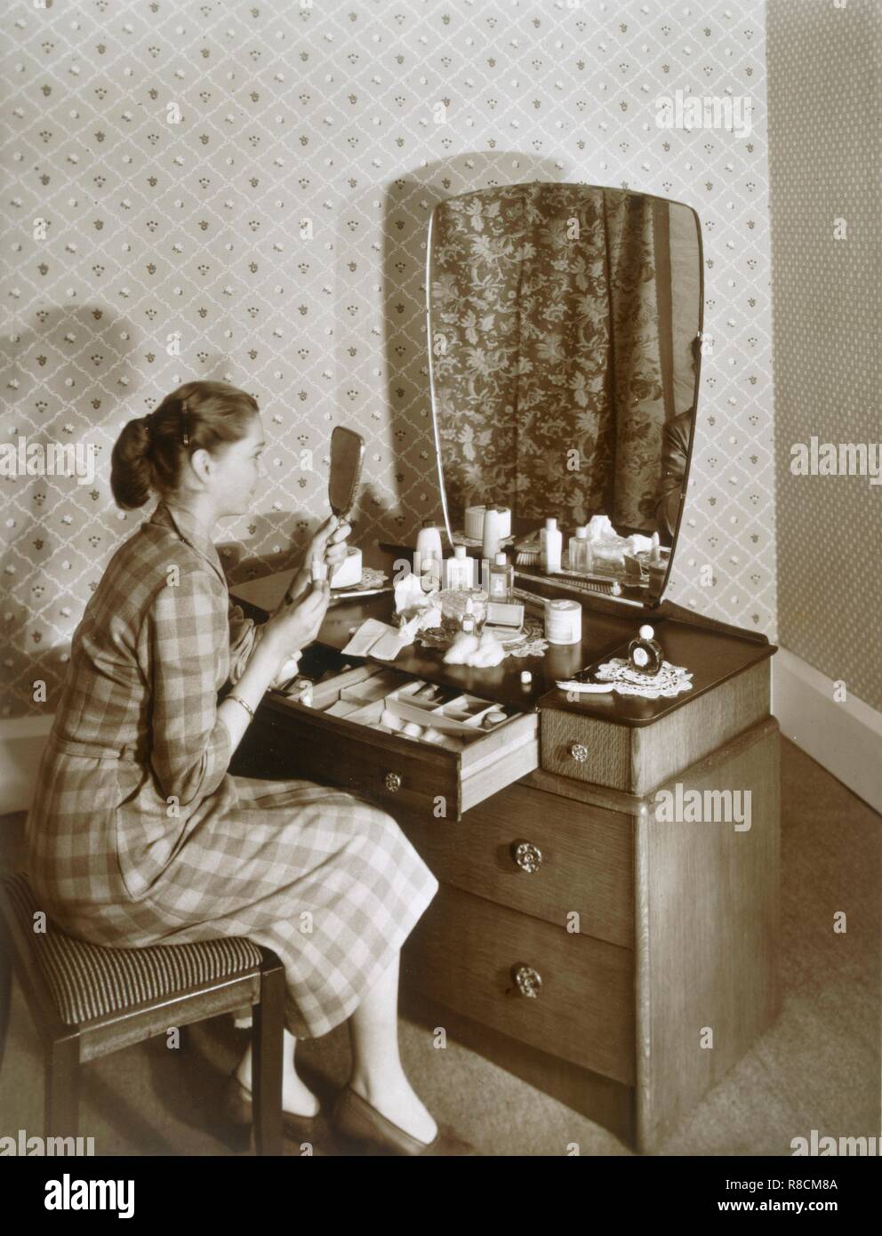 Woman at her dressing table, c1955. Creator: English Photographer (20th ...