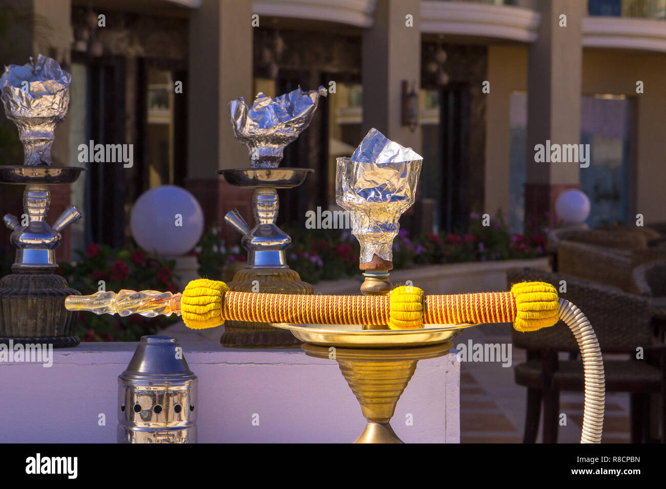 yellow modern hookah under the sun on street Stock Photo - Alamy