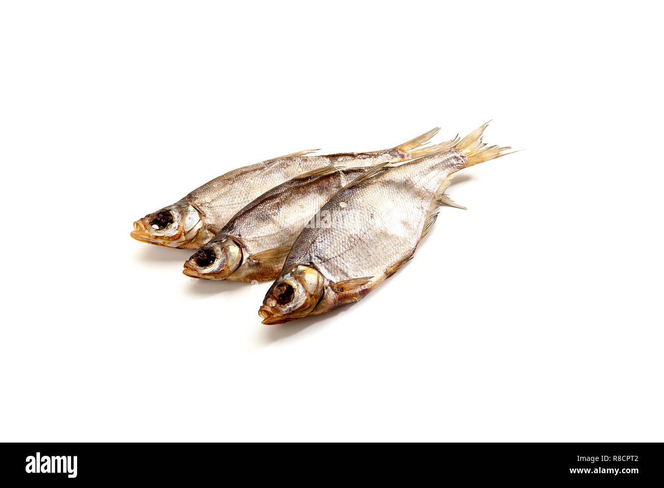 Dried salty fishes isolated on Cut Out Stock Images & Pictures - Alamy