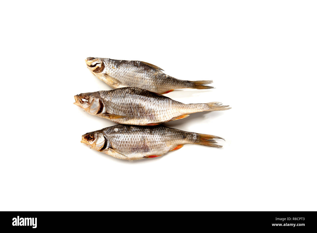 Dried salted fish sticks isolated on white Stock Photo - Alamy