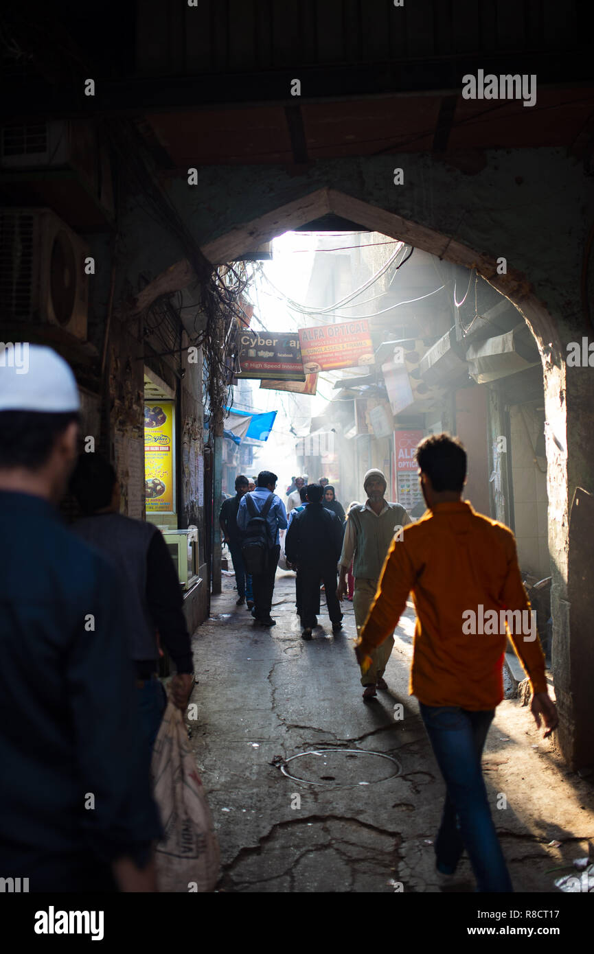 Daily life on the streets of Old Delhi at sunset. Old Delhi is a walled ...