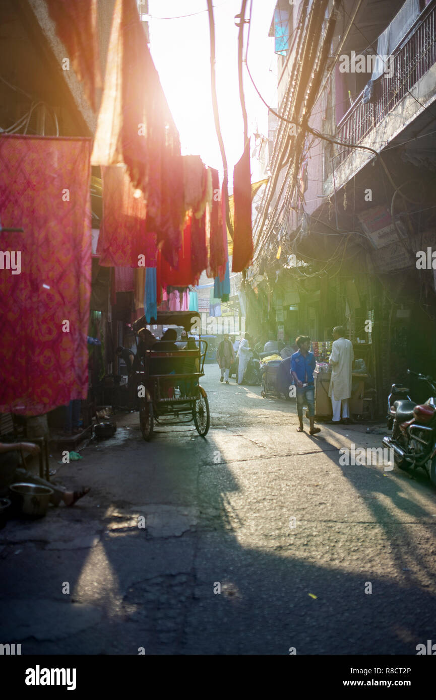 Daily life on the streets of Old Delhi at sunset. Old Delhi is a walled ...