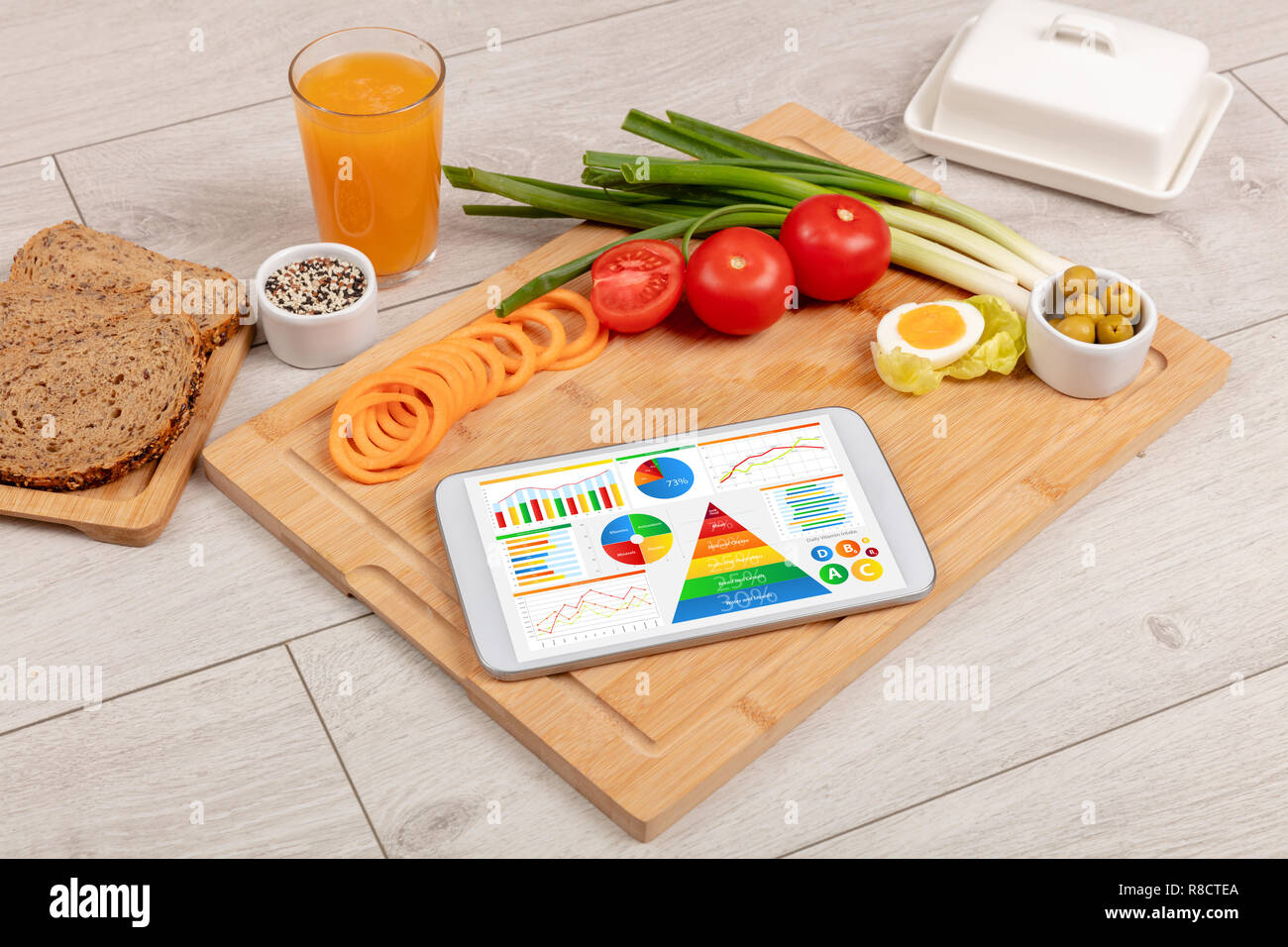 healthy eating concept - close up of tablet with several dieting ...