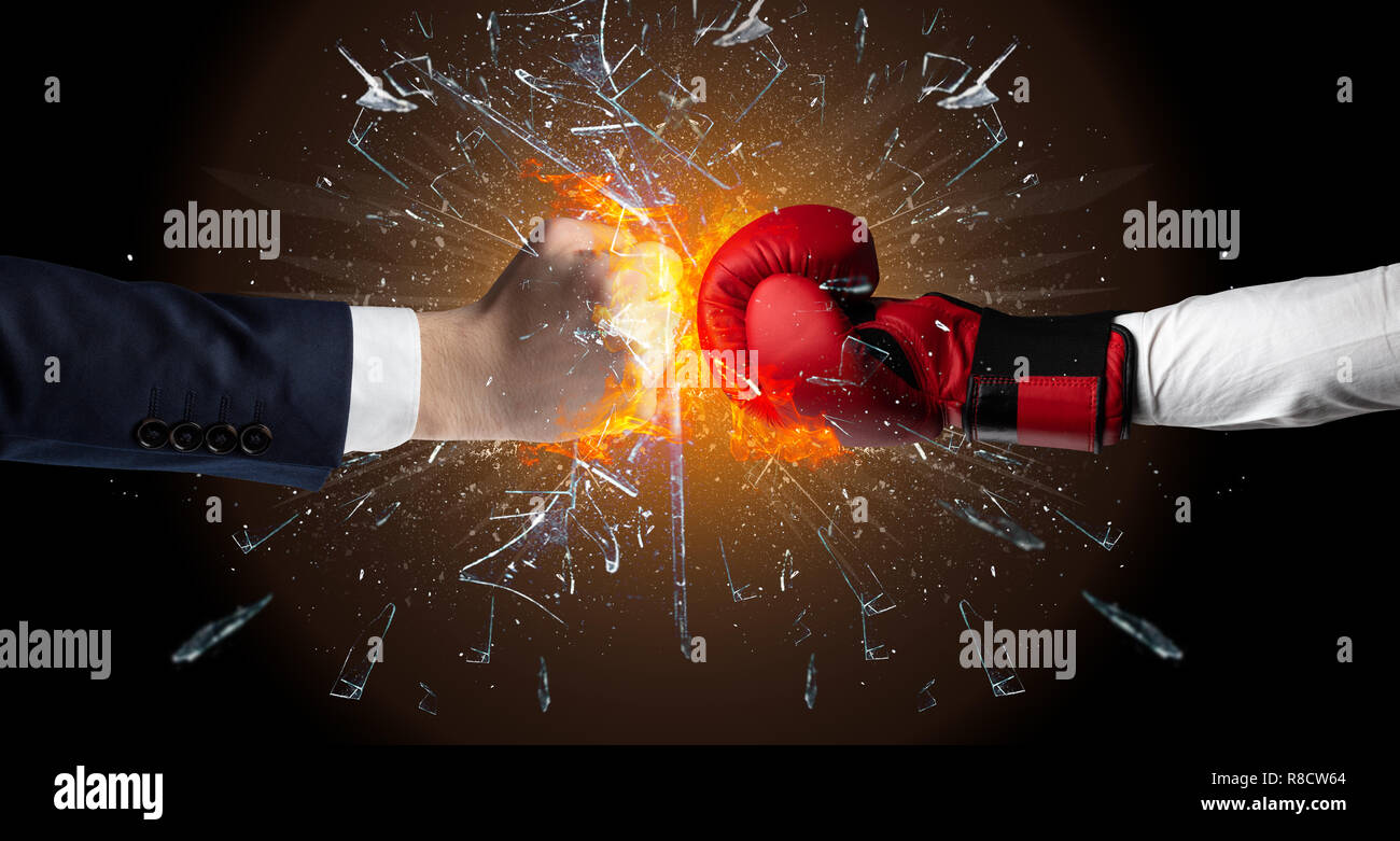 Two hands fighting and breaking a glass into small pieces Stock Photo ...