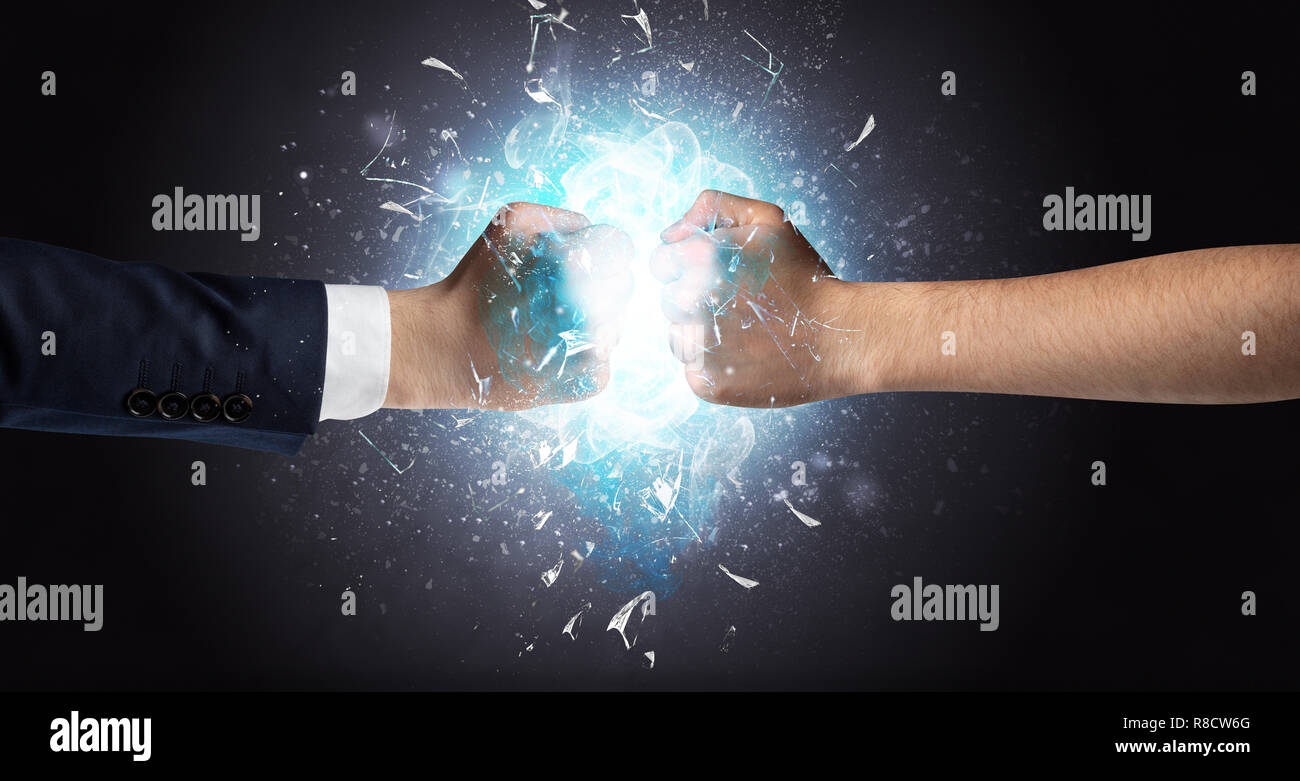 Two hands fighting and breaking glass into small pieces with blue light ...