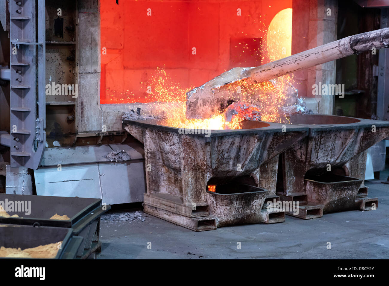 skimming melted aluminum for removing the dross before casting ...