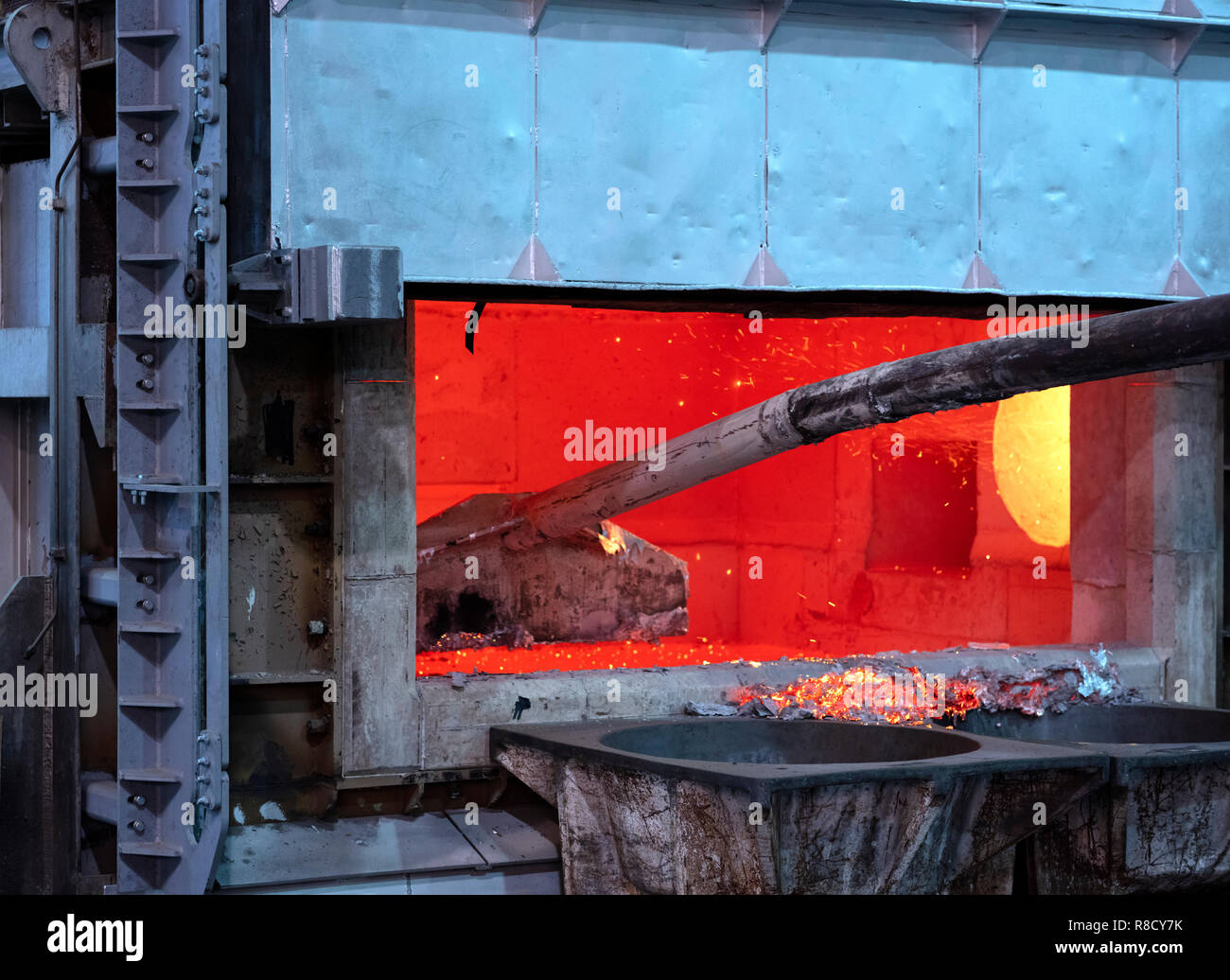 skimming melted aluminum for removing the dross before casting ...