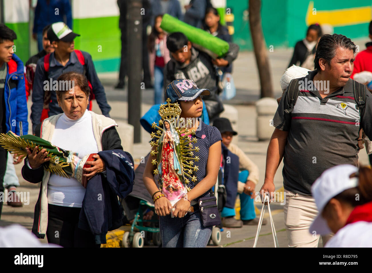 A pilgrim carrying the statue of the Virgin Mary in Mexico City, Mexico ...