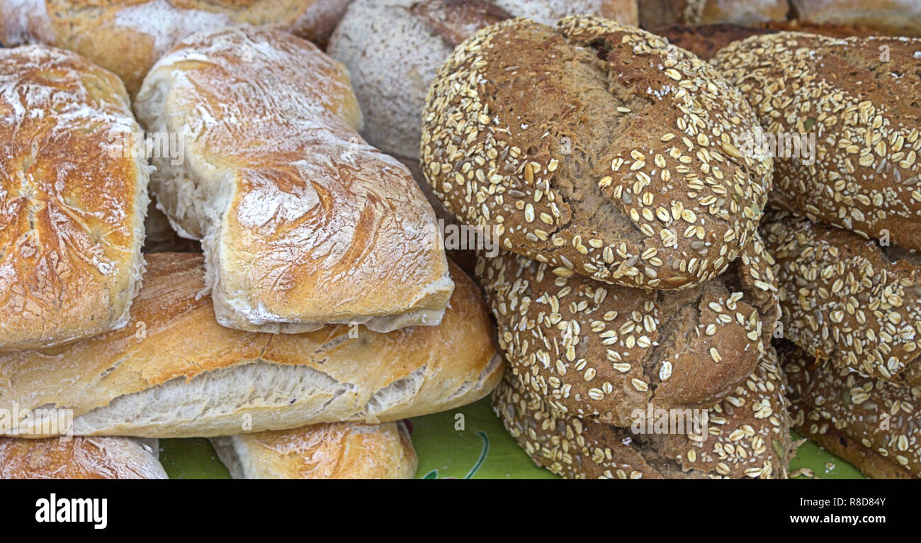 close up of fresh baked granary and white loaves of bread Stock Photo ...