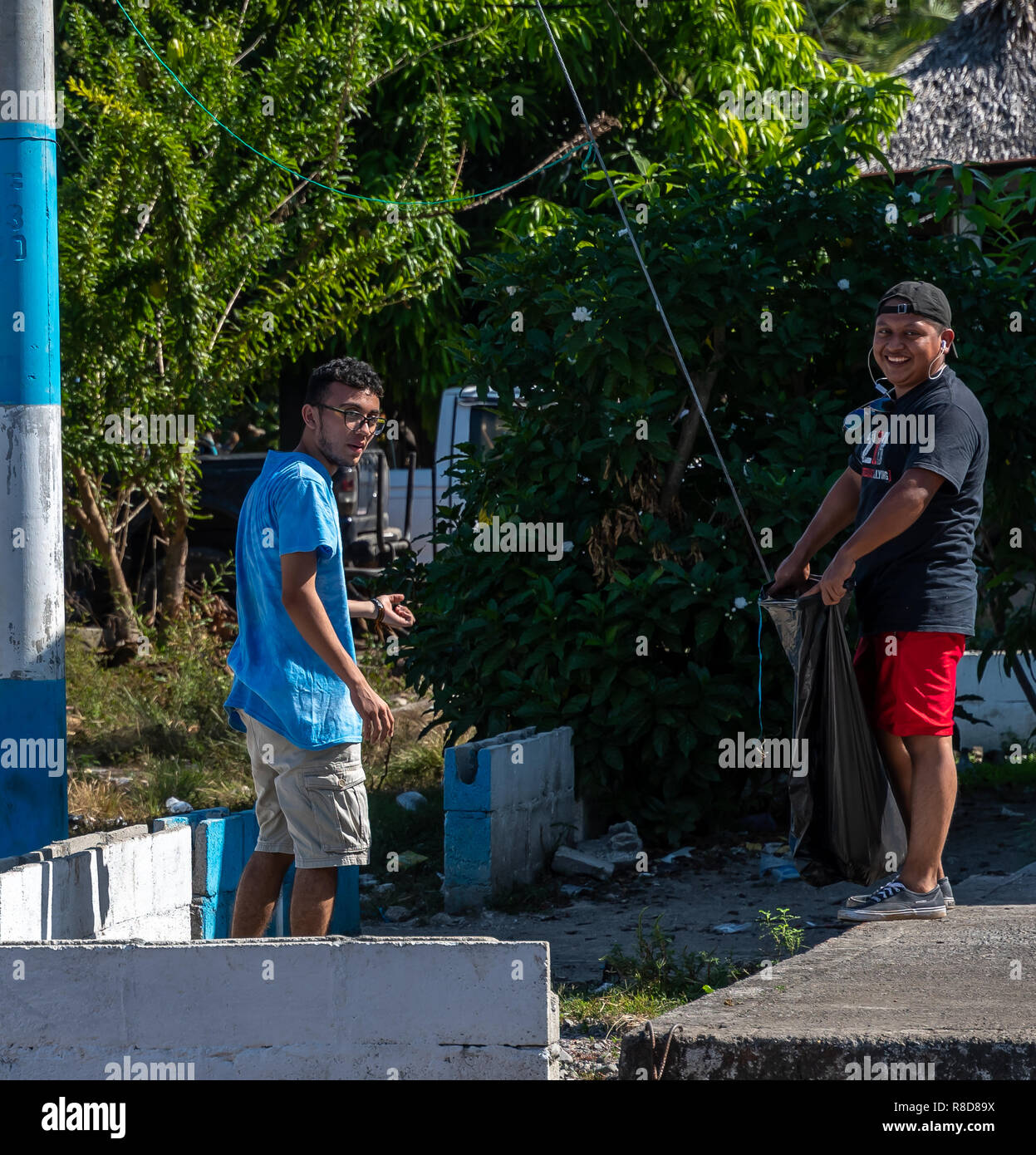 Guatemalan youth volunteering cleaning up village Stock Photo - Alamy