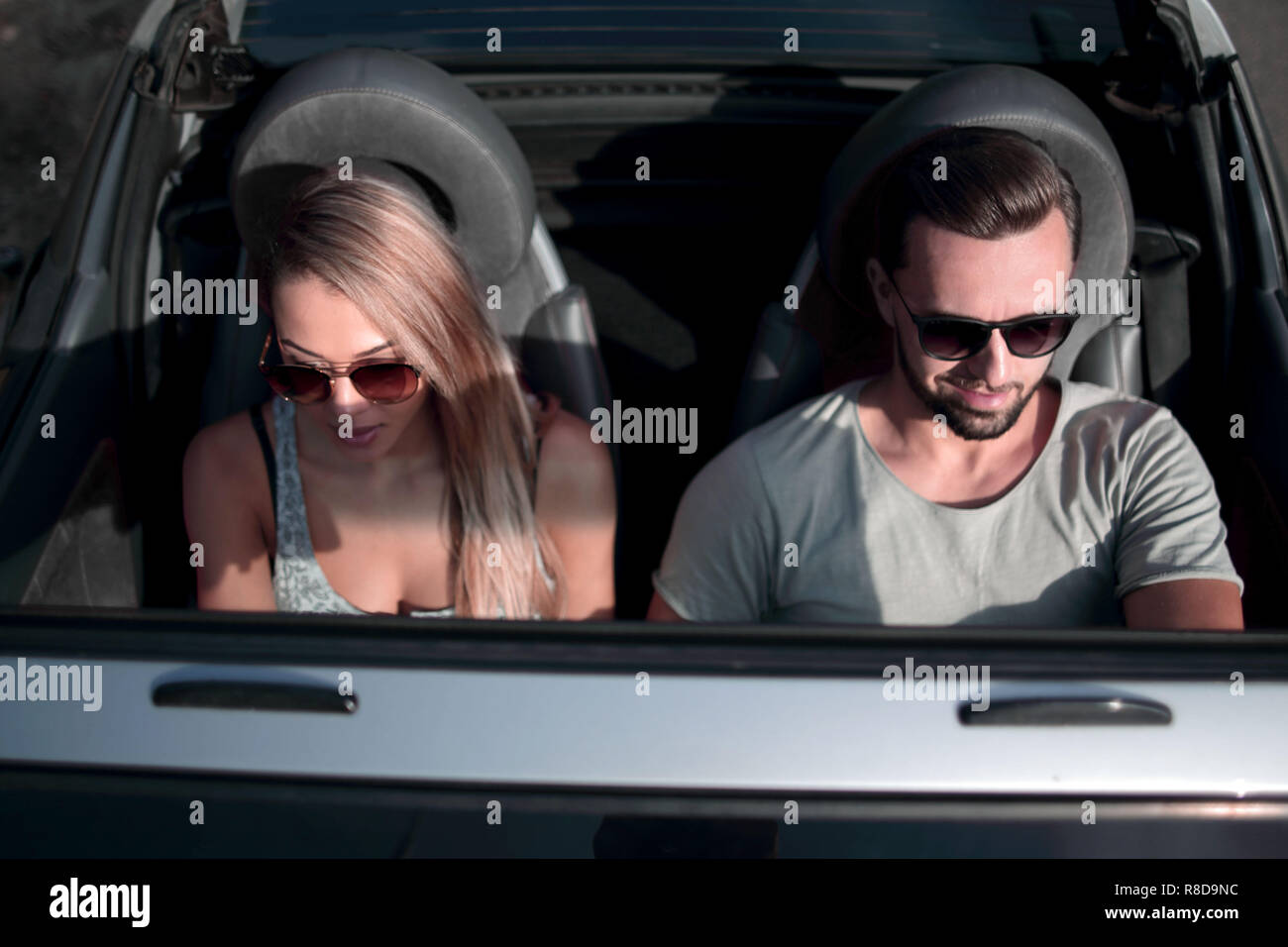 Two male friends driving a car hi-res stock photography and images - Alamy